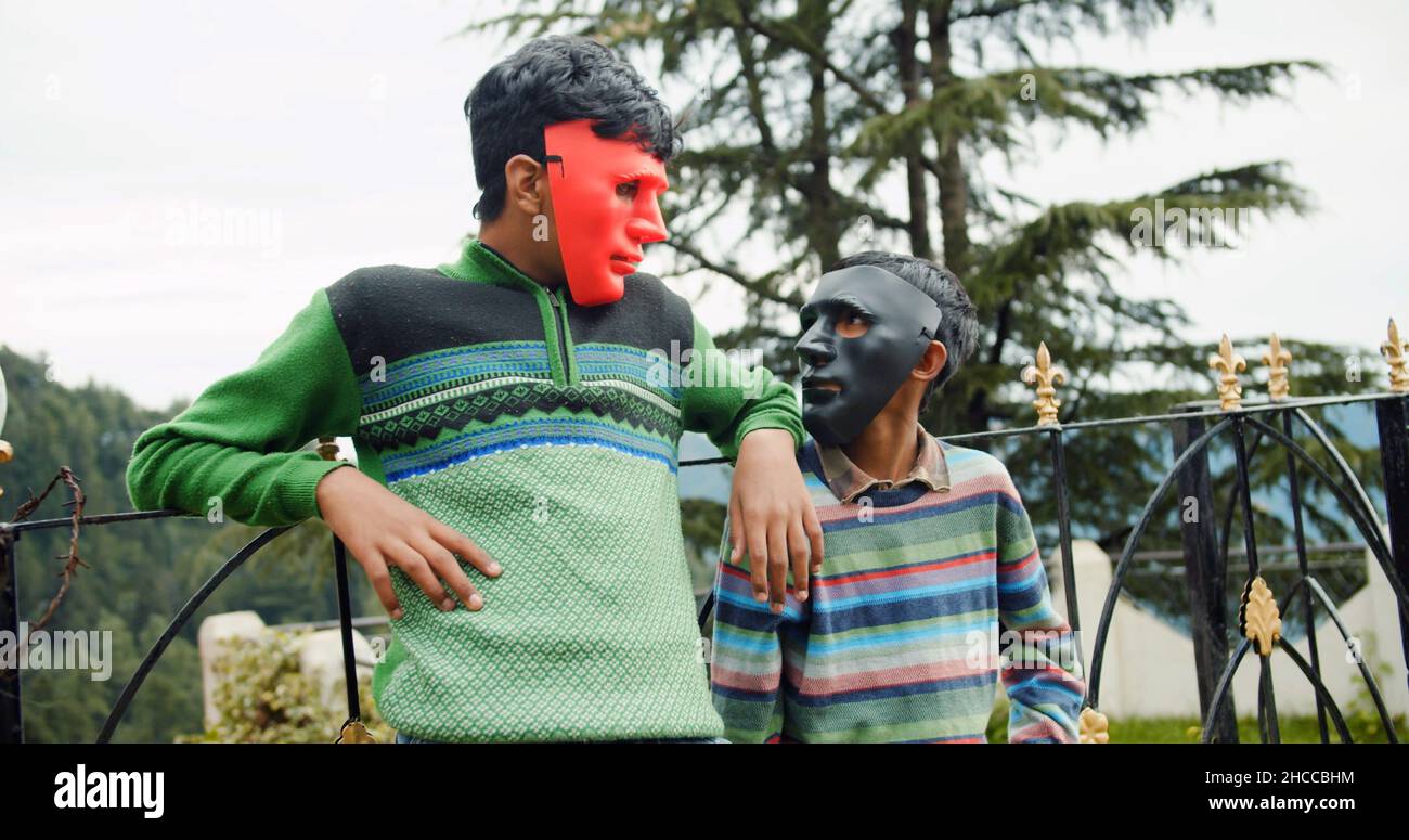 Male young South Asian friends in scary masks in India Stock Photo - Alamy