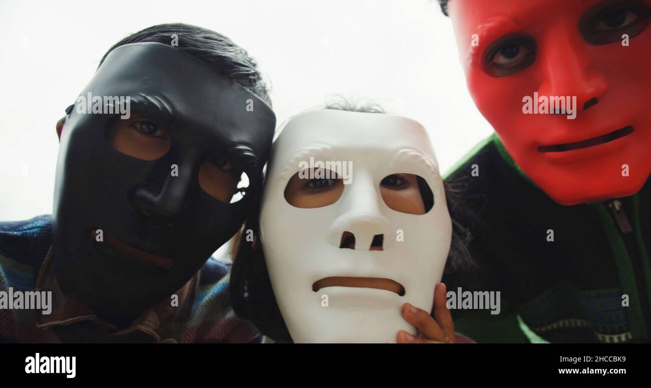 Group of young South Asian friends in scary masks in India Stock Photo ...