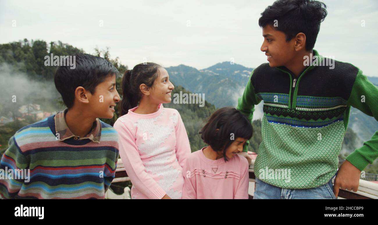 Group of young South Asian friends smiling with a background of ...