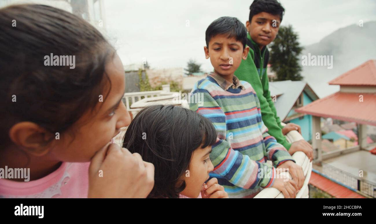 Group of young South Asian friends talking at a balcony in India Stock ...