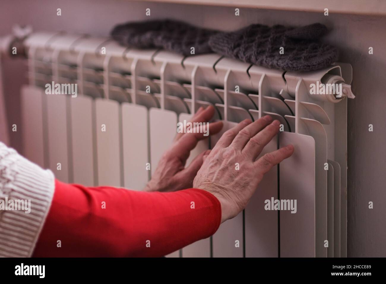 Man feeling cold at home with home heating trouble Stock Photo - Alamy