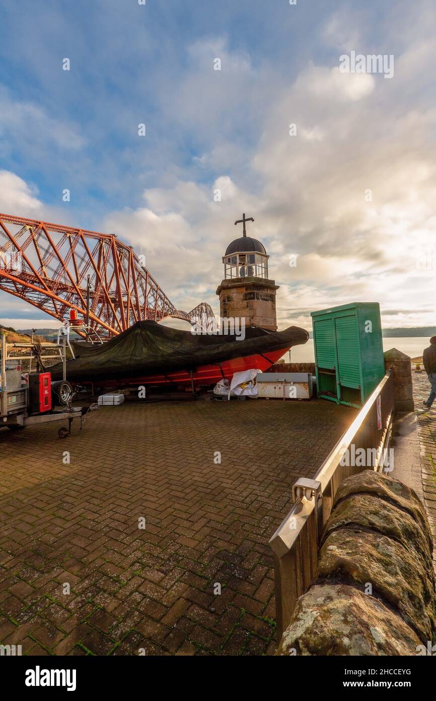 The Harbour Light Tower and the Forth Bridge in North Queensferry, Fife ...