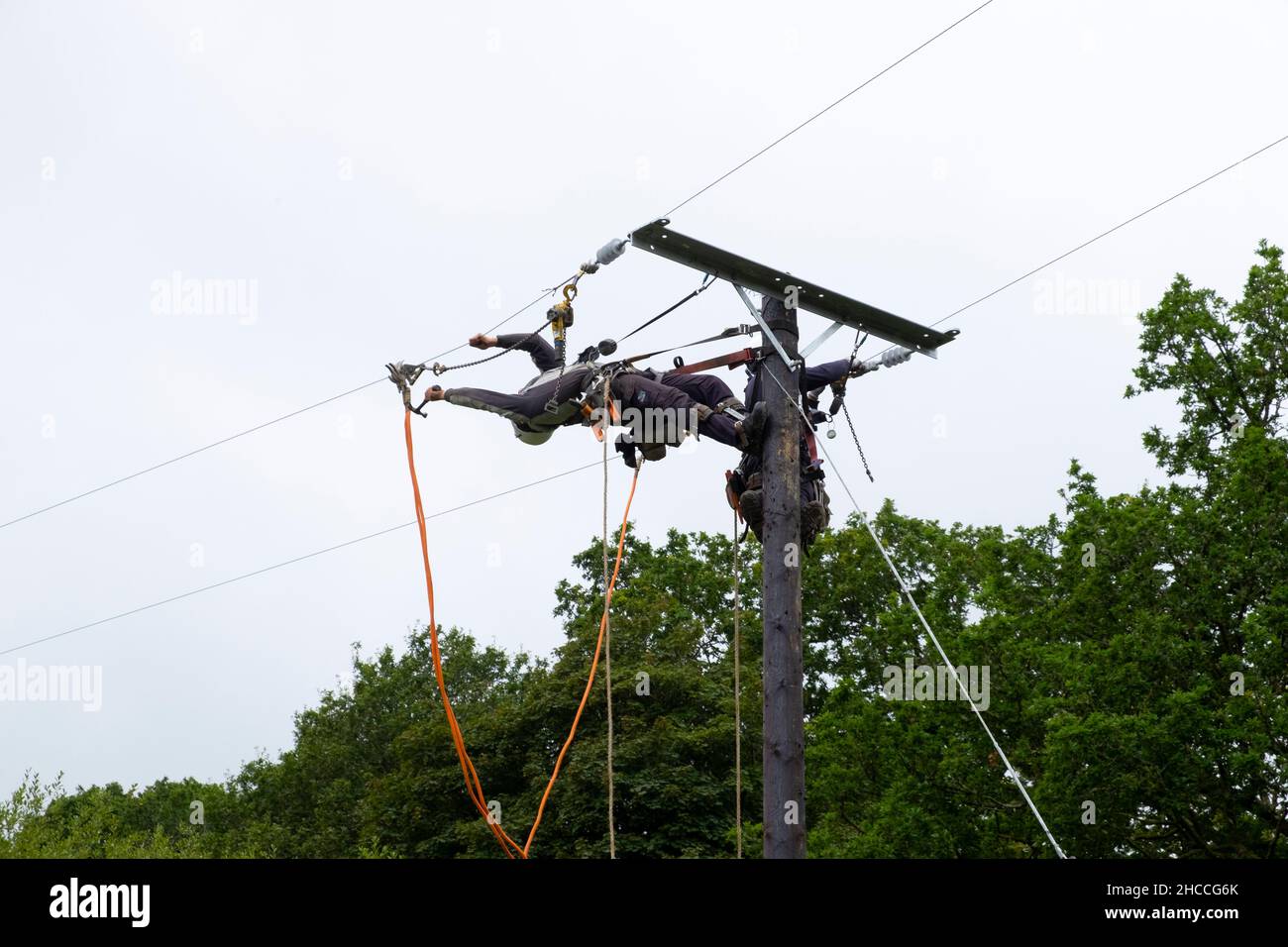 Worker climbing utility pole hi-res stock photography and images - Alamy