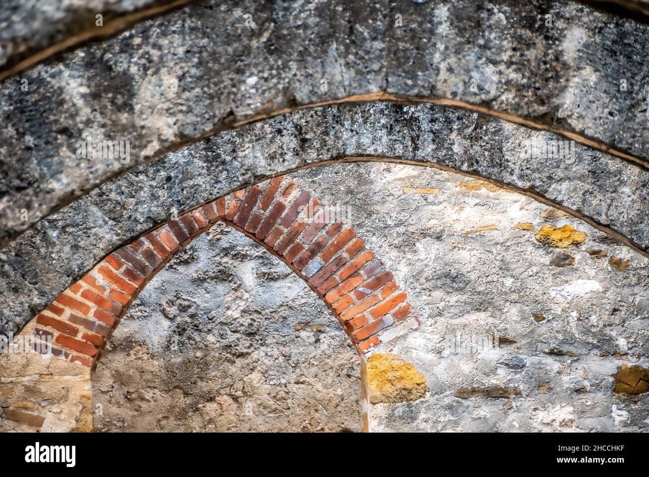 Stone archways leading to an arched doorway Stock Photo - Alamy