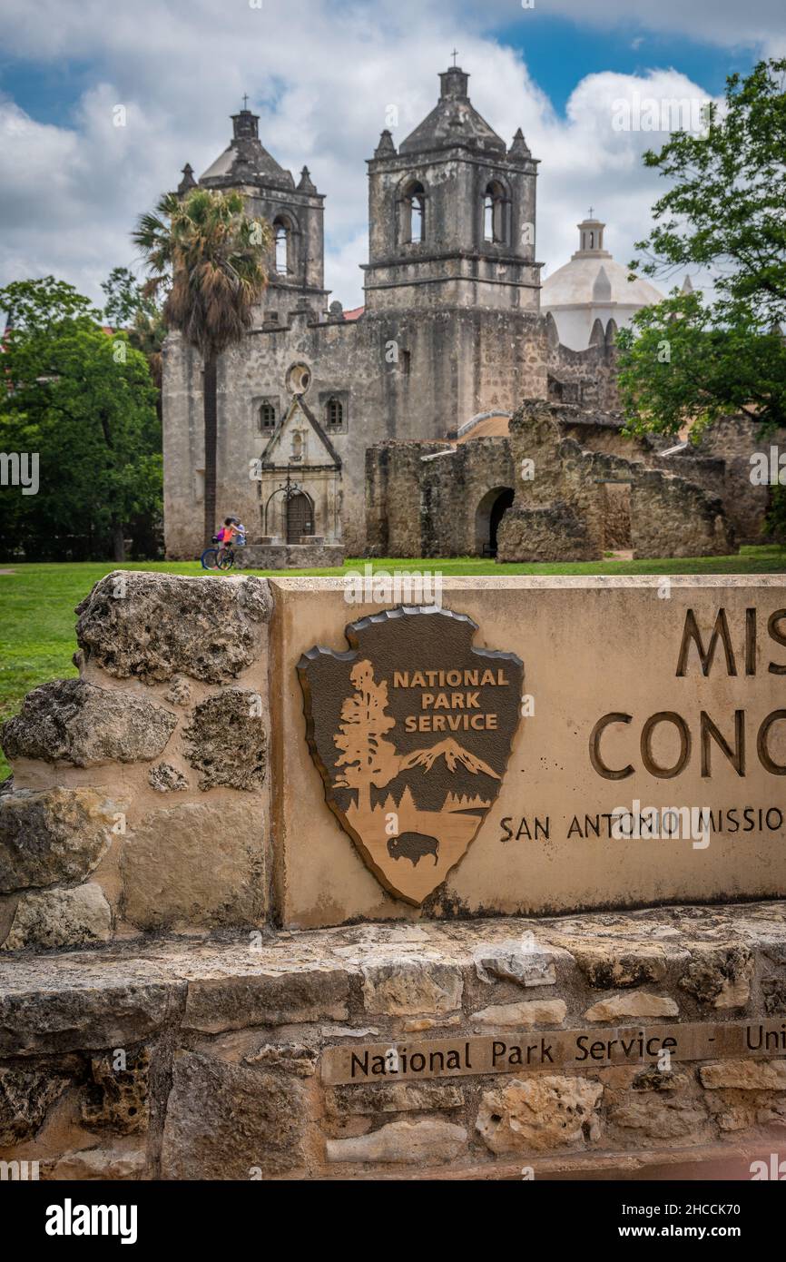 Mission Concepcion towering behind a National Park Service sign Stock ...