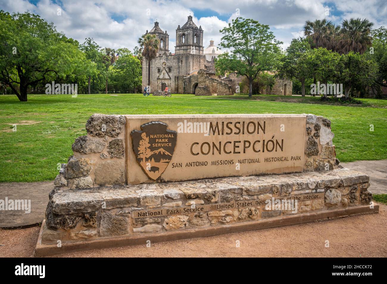 Mission Concepcion towering behind a National Park Service sign Stock ...