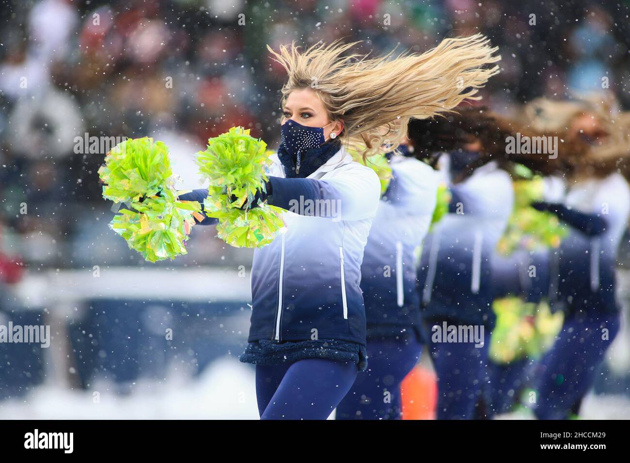 Seattle, WA, USA. 26th Dec, 2021. Hair flies from a Seattle Seahawks ...