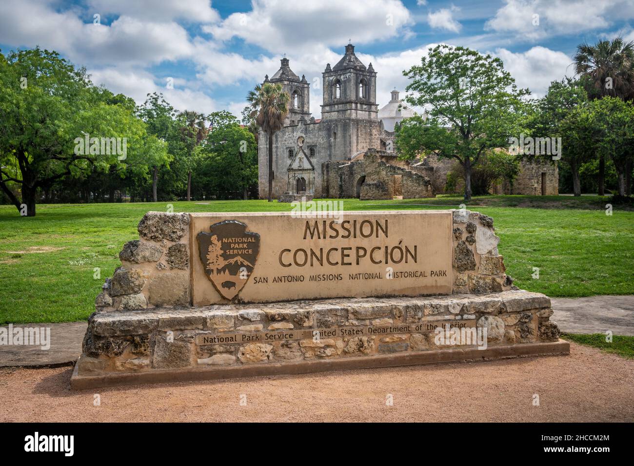 Mission Concepcion towering behind a National Park Service sign Stock ...