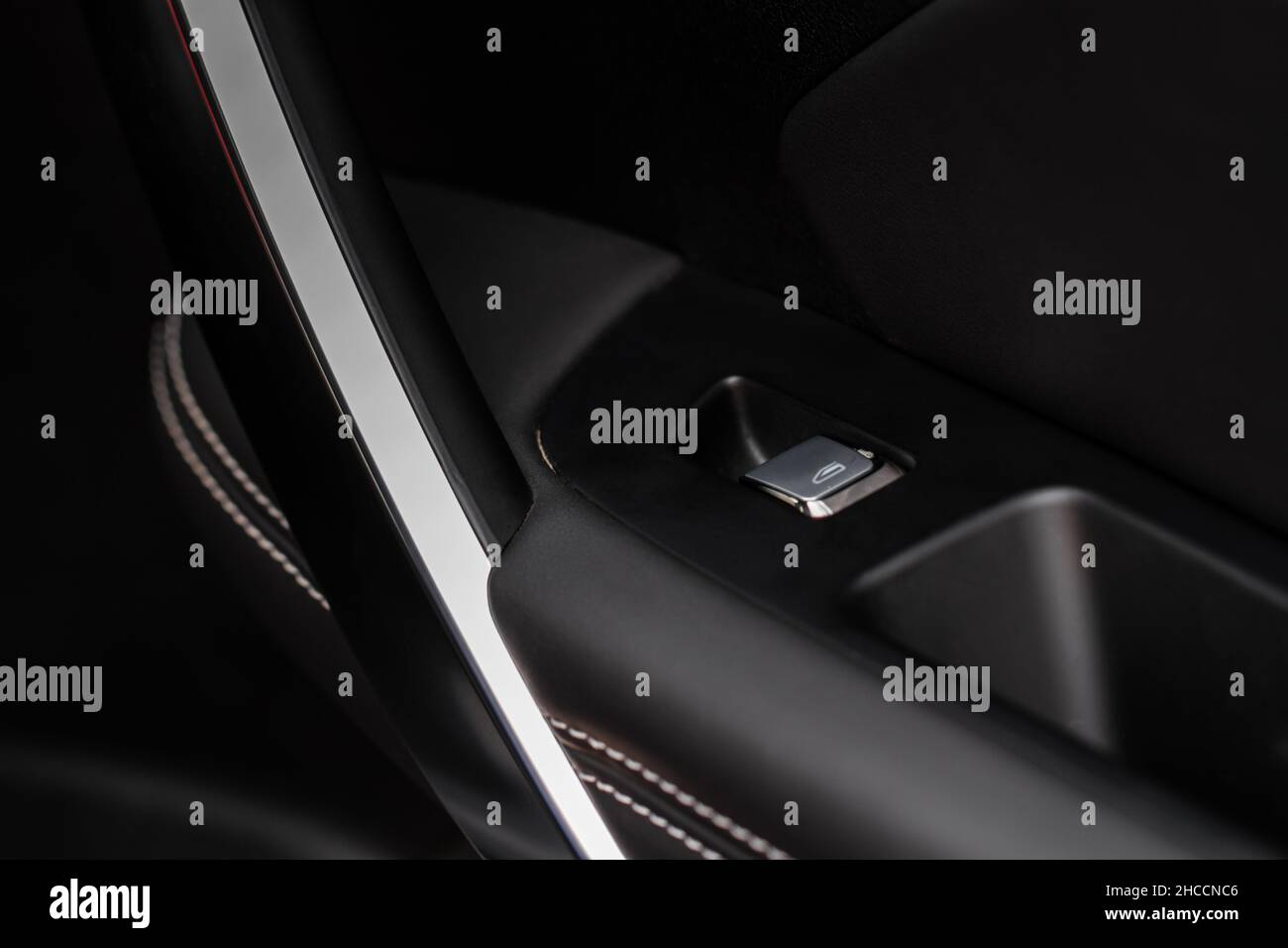 Close up view of button controlling window in modern car interior ...