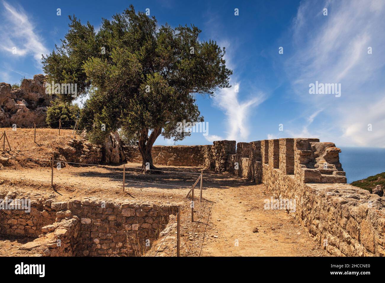 Ancient stone ruins of cliff fortress Angelocastro, Corfu island ...