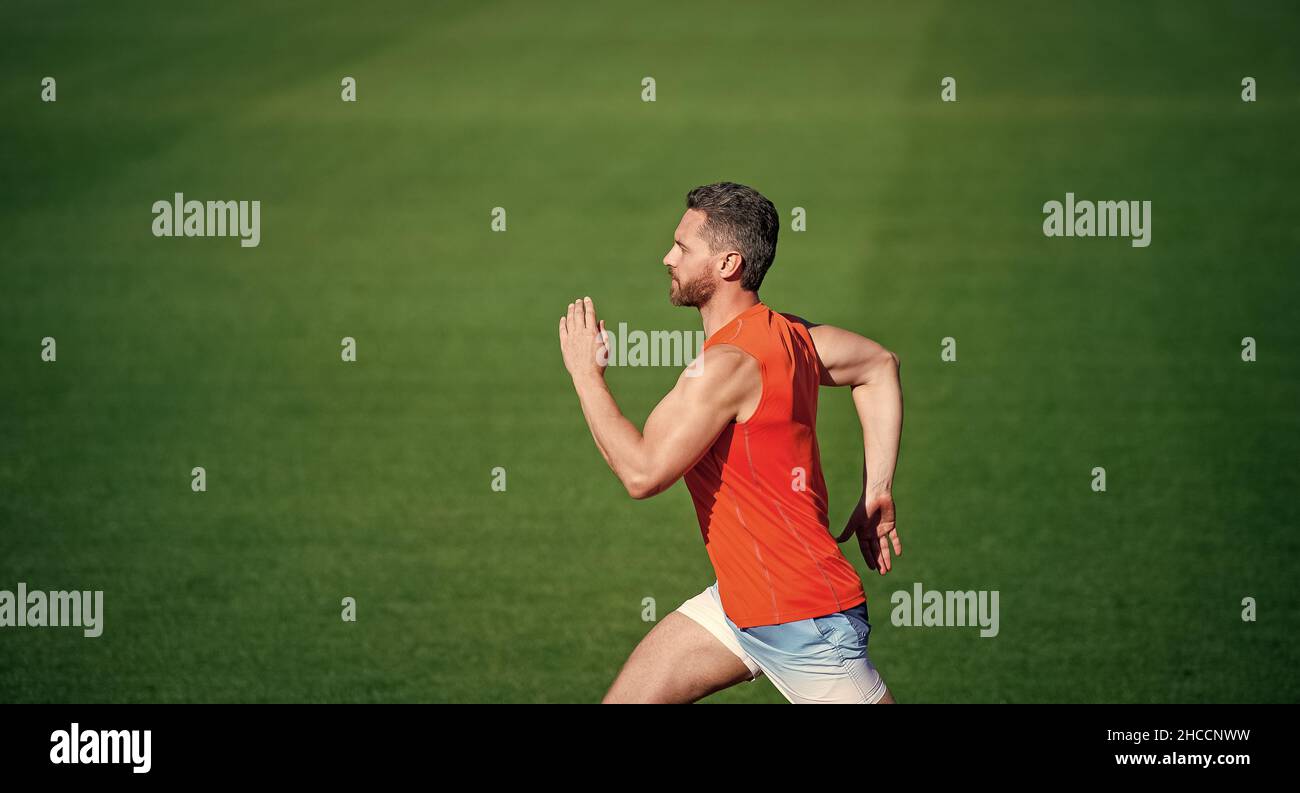 energetic man on running track. sporty runner. stamina. sport and ...