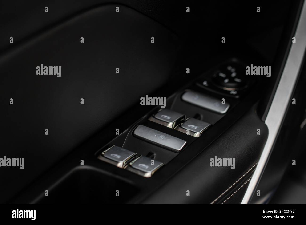 Close up view of button controlling window in modern car interior ...