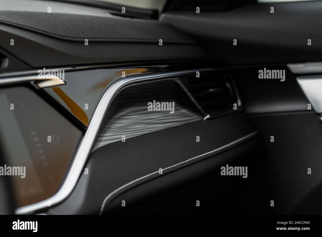 Modern car interior close up view with metallic and plastic details ...