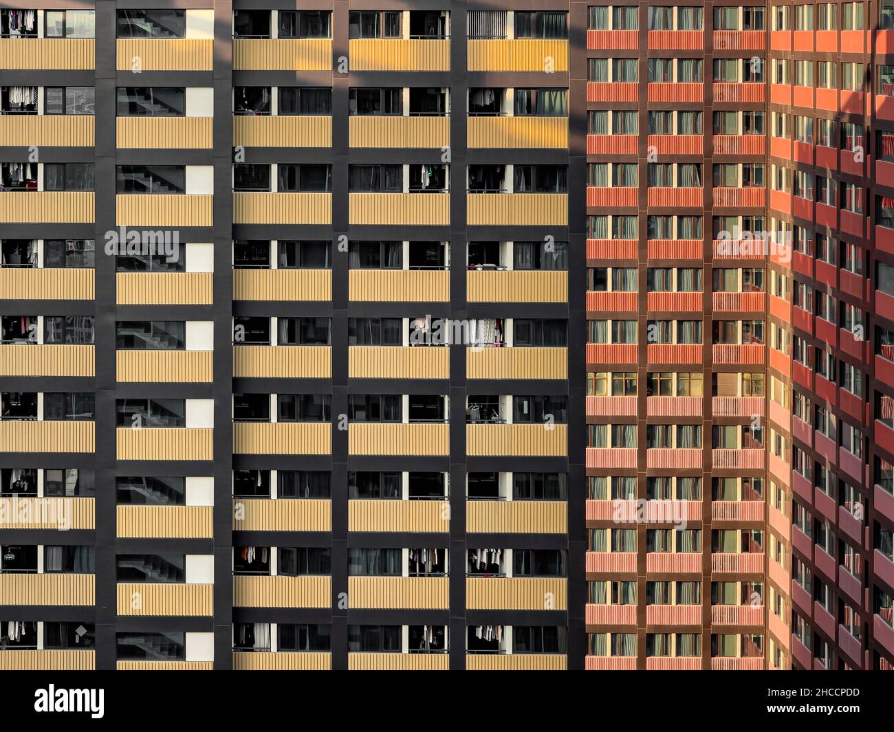 Facade of apartment buildings with balconies and glass windows on a ...