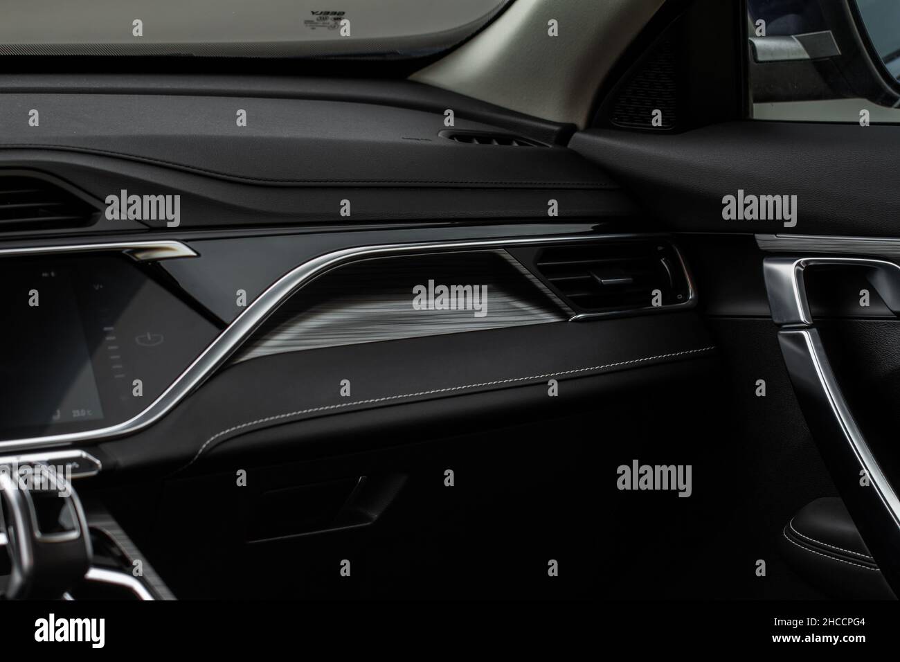 Modern car interior close up view with metallic and plastic details ...