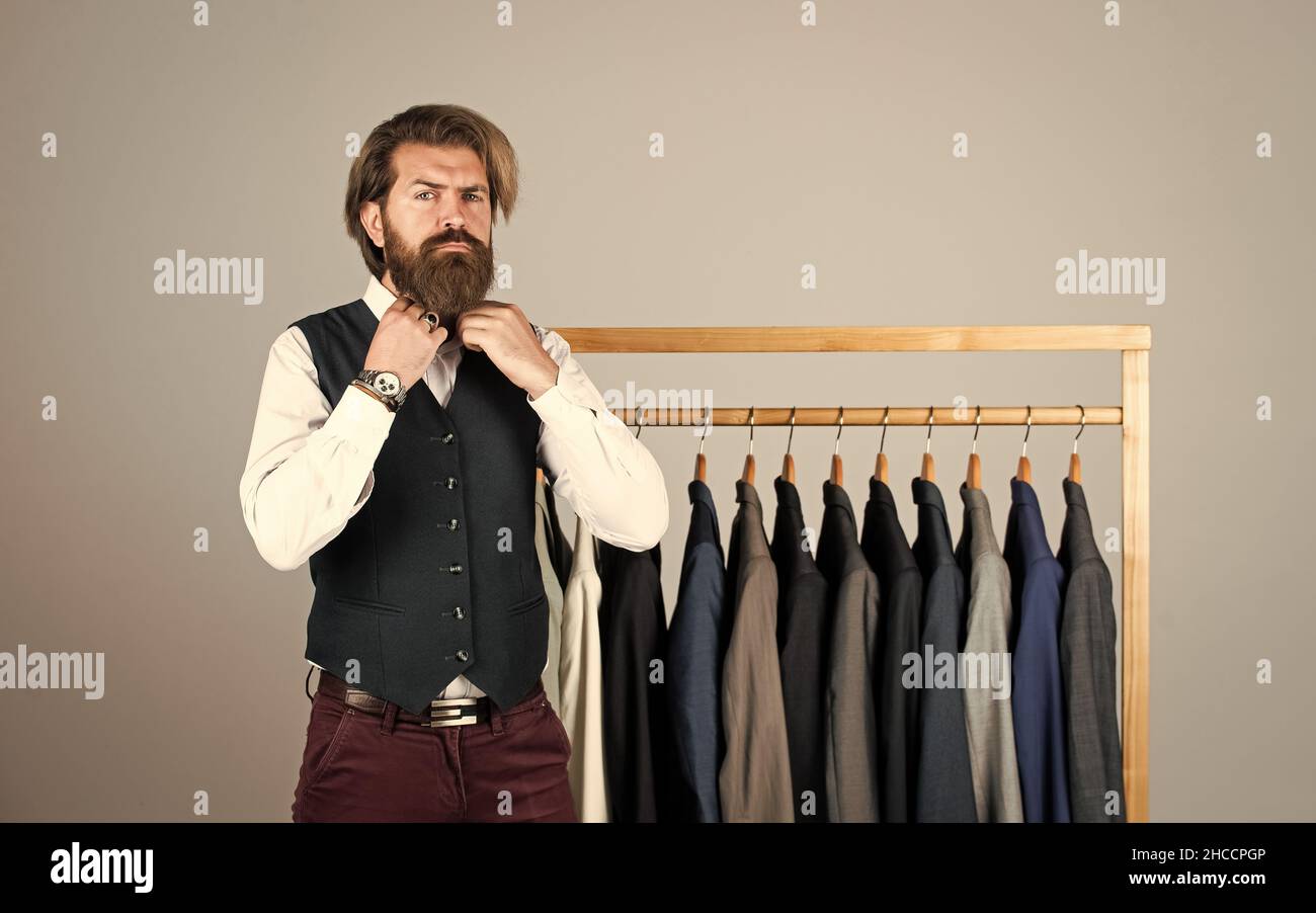 Man picking suit from personal wardrobe, male fashion concept Stock ...