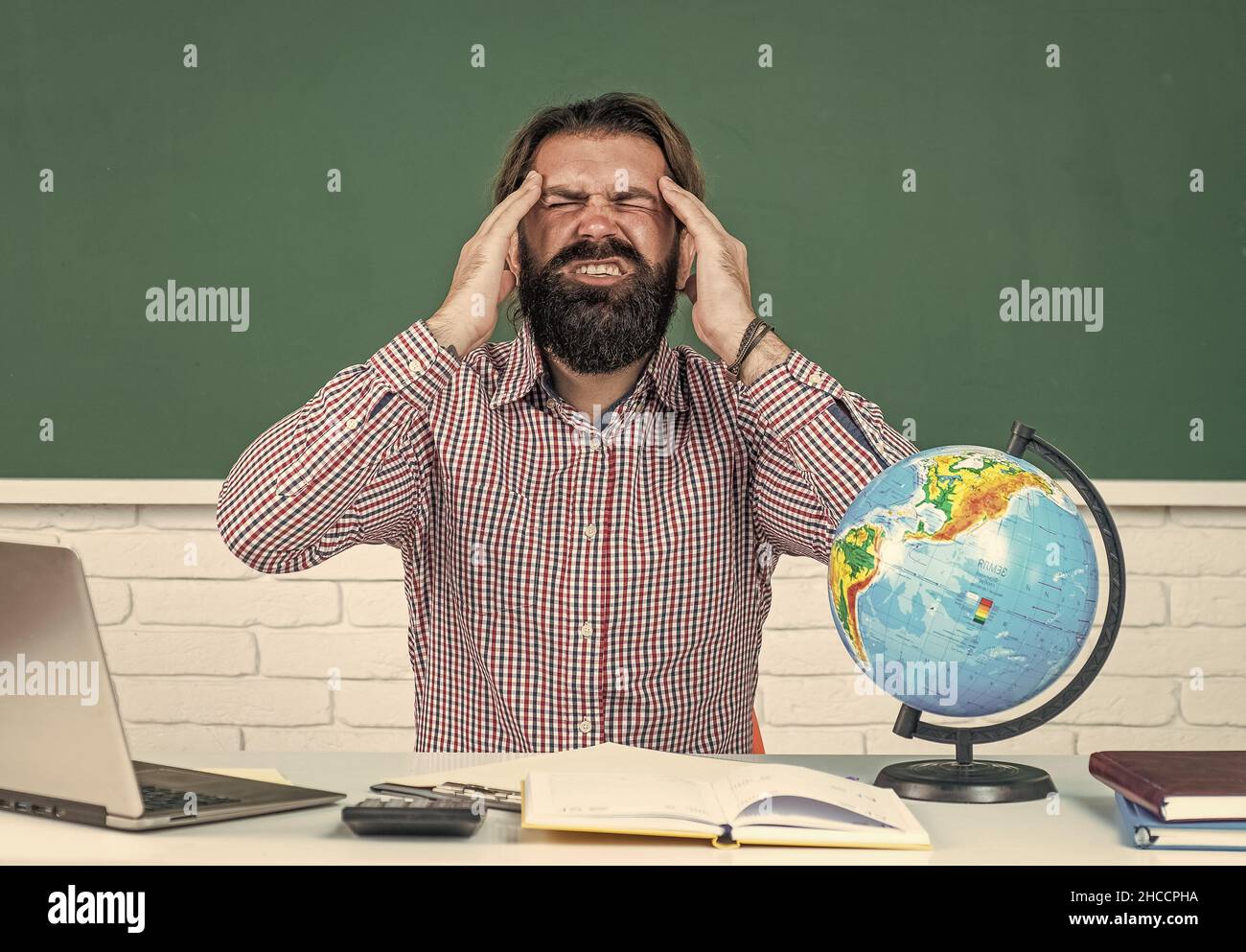 troubles in studying. formal education. male student sit in school ...