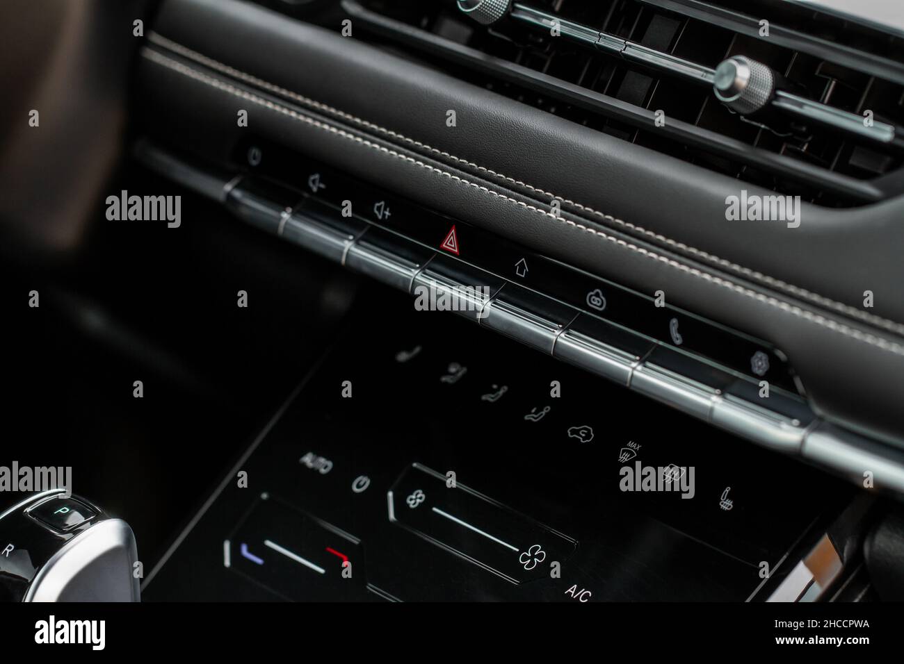 Red triangle hazard light button on car dashboard. Car media buttons ...