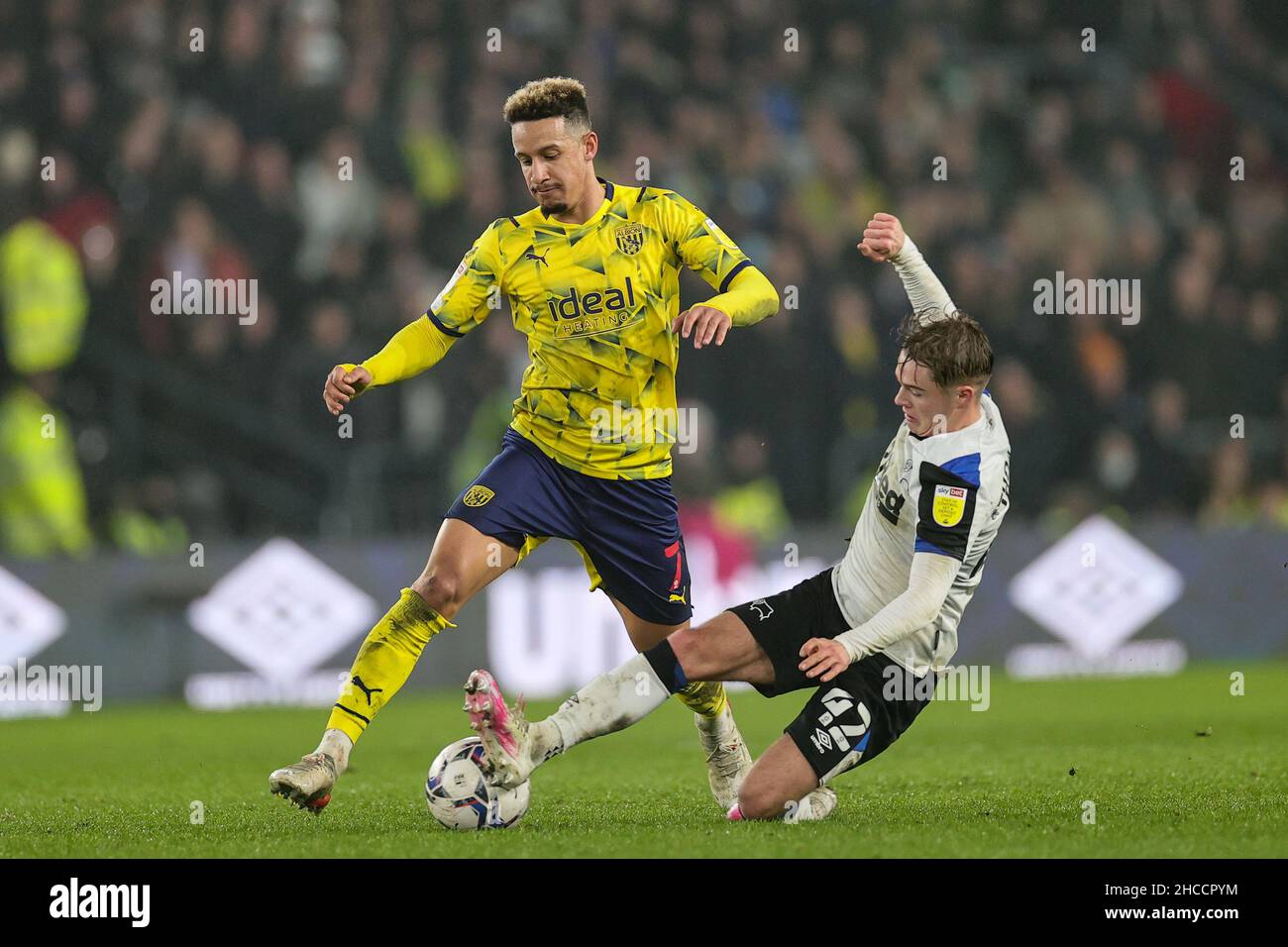 Liam Thompson #42 of Derby County challenges Callum Robinson #7 of West ...