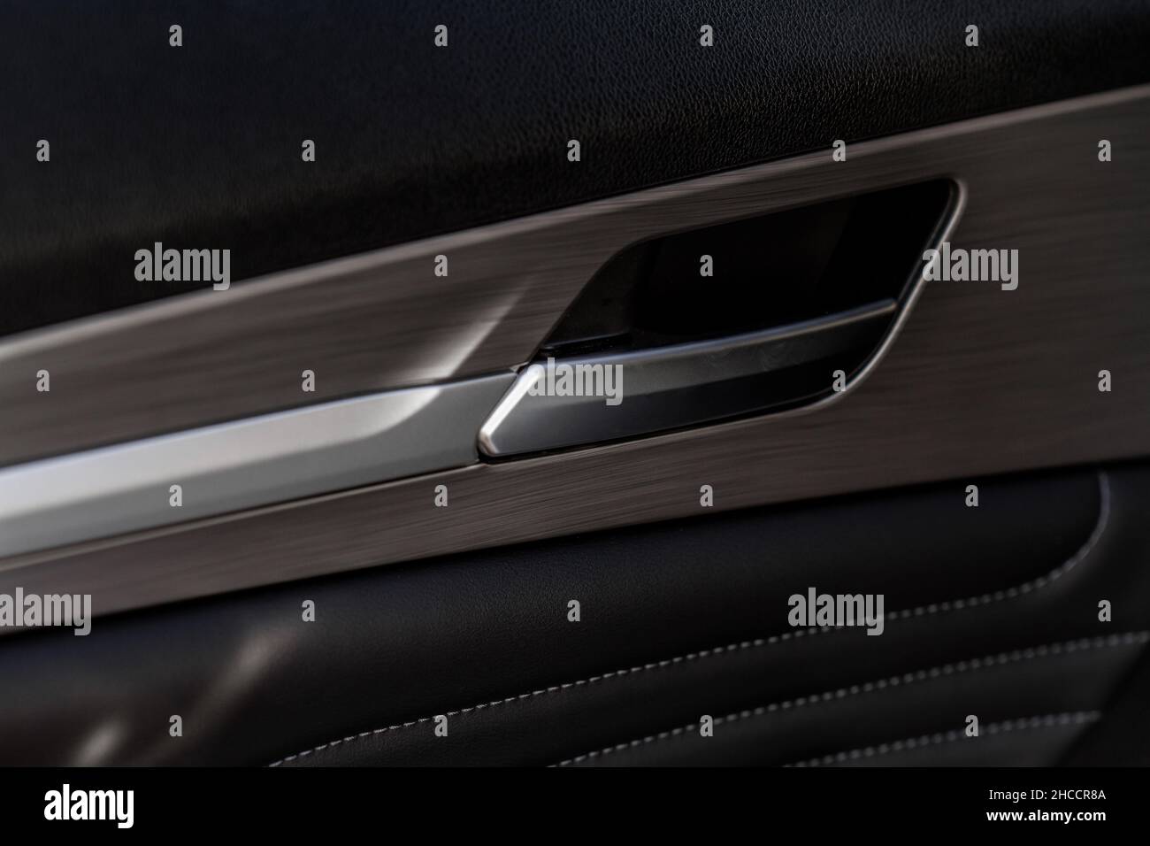Modern car interior door handle close up. Metallic Car door opener ...