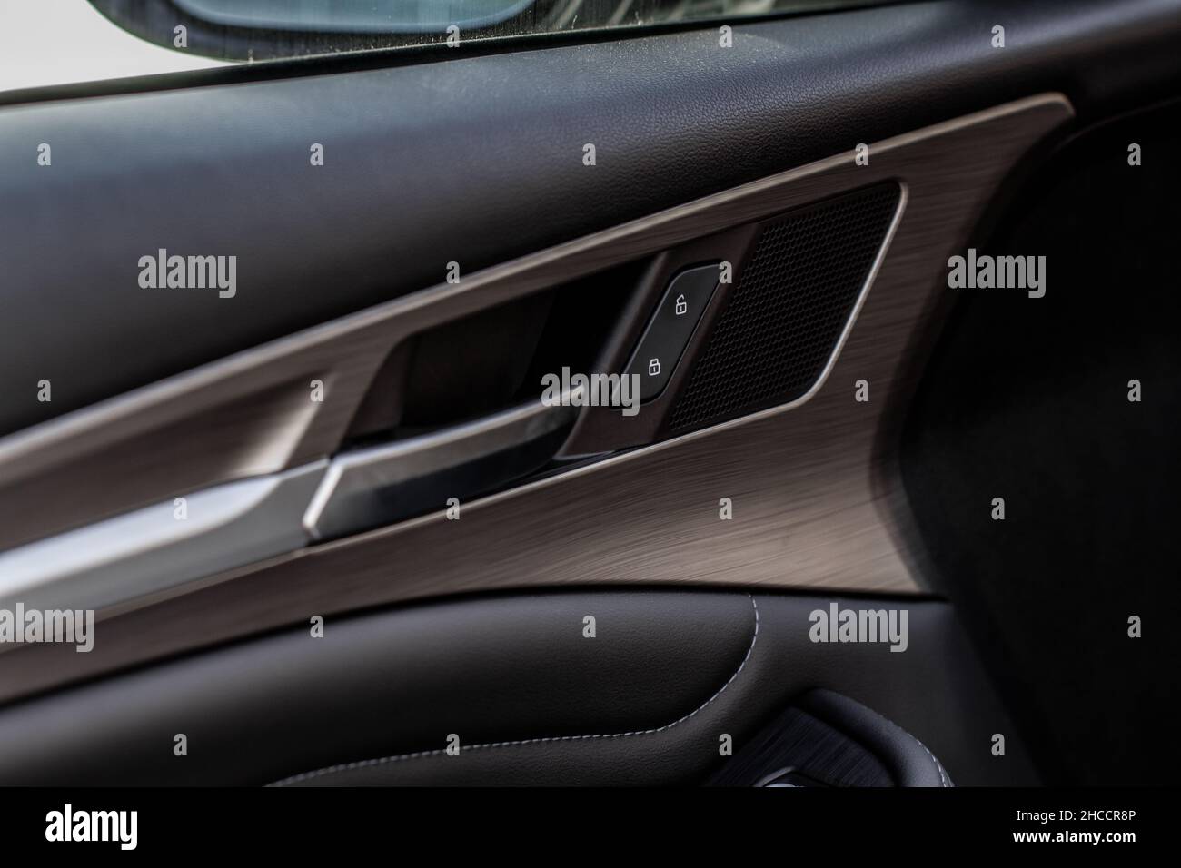 Car door lock switch close up. A car lock button. Car door handle with ...