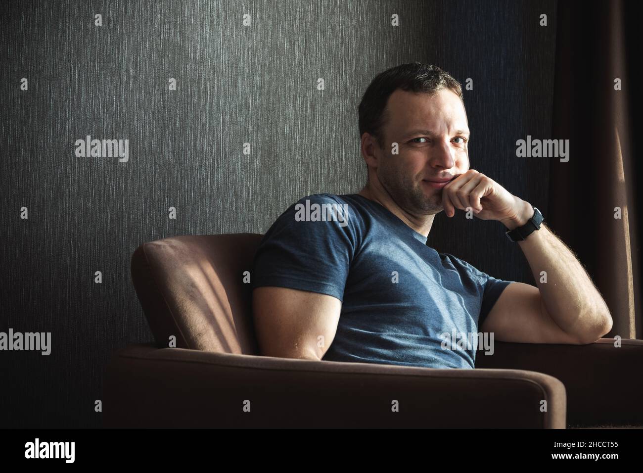 Young man sitting chair happy casual hi-res stock photography and ...