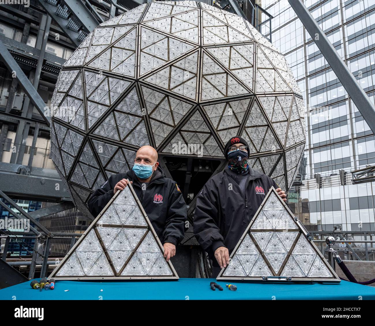 Robert Stults and Nicholas Bonavita of AMA Electric & Signs present the ...