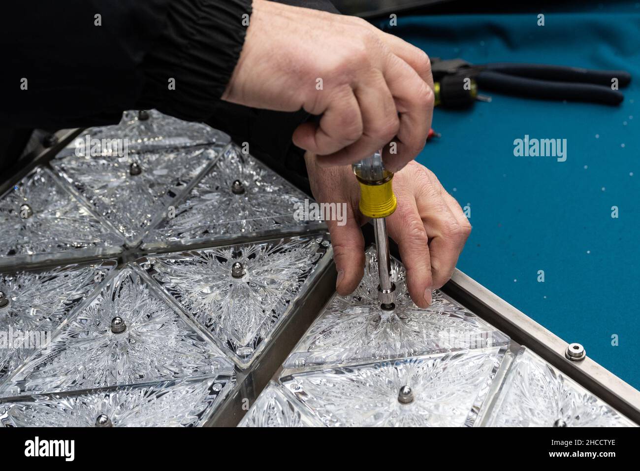 Robert Stults of AMA Electric & Signs installs one of the new Waterford ...