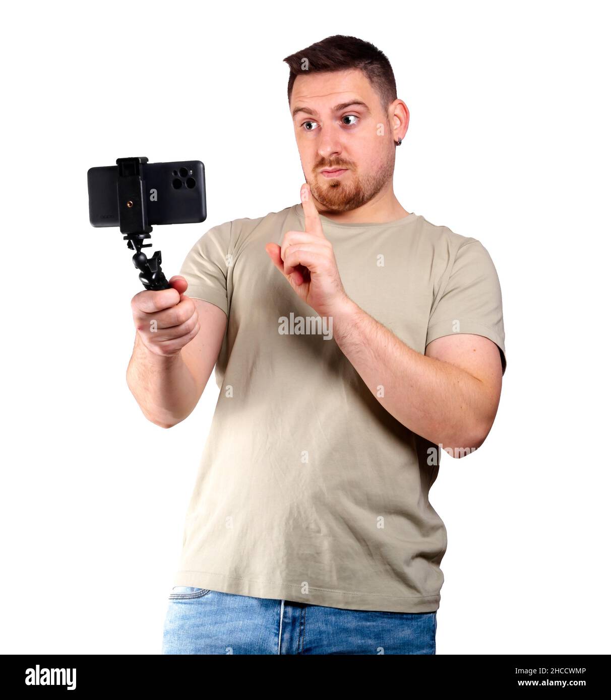 Spanish man doing a selfie with a selfie stick isolated on a white ...