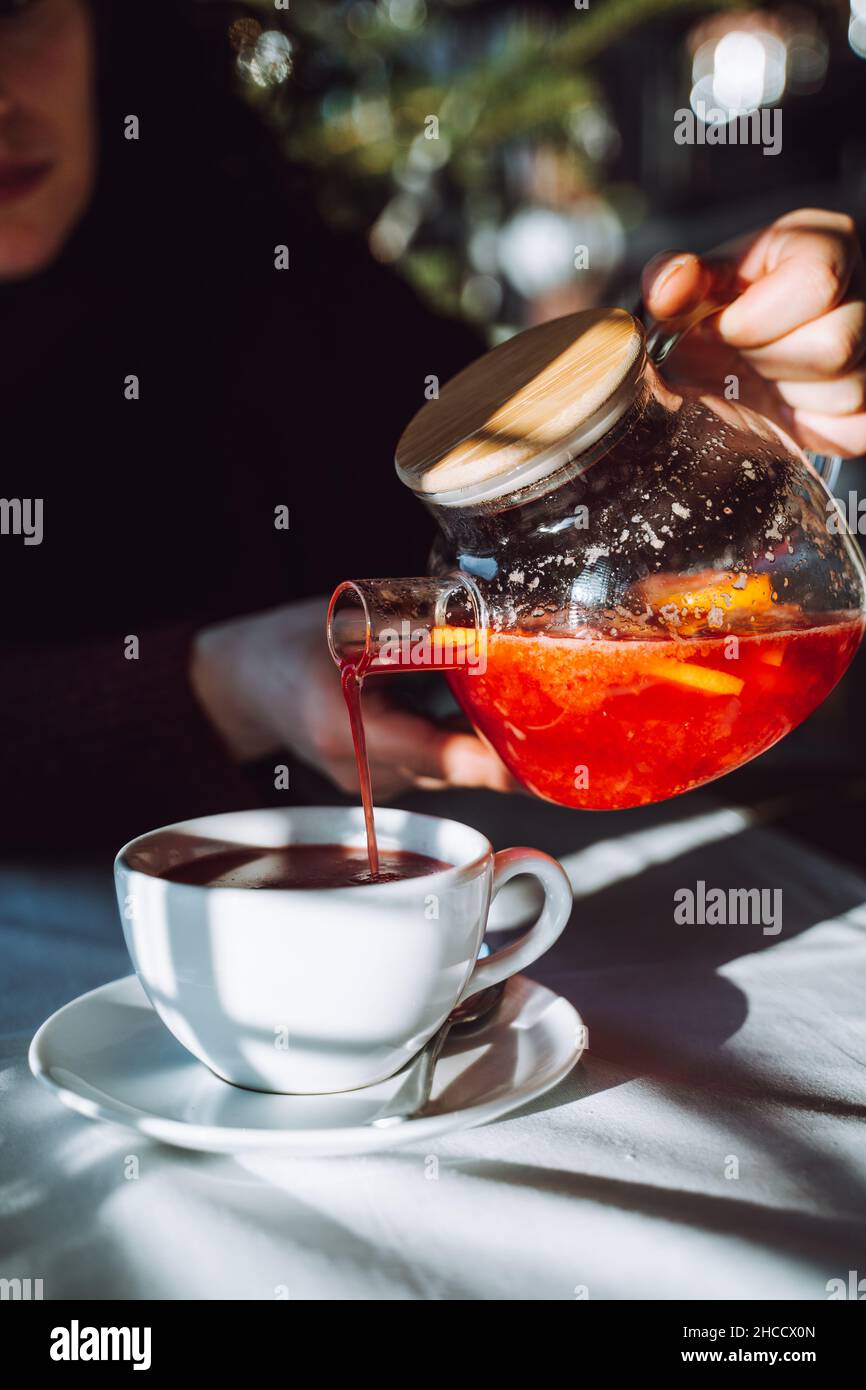 Woman pours hot tea from hi-res stock photography and images - Alamy