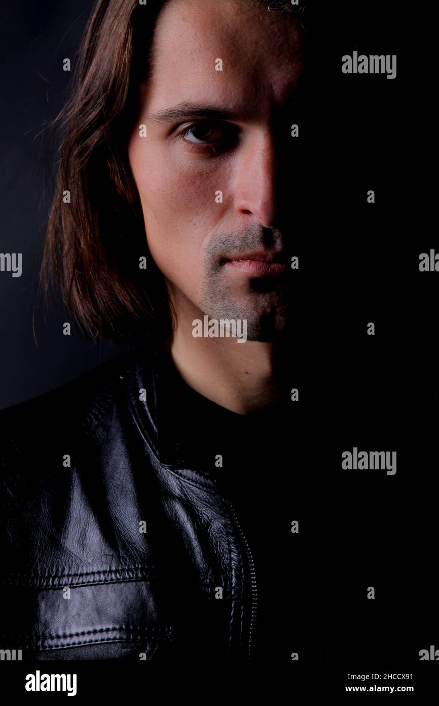 Portrait of a man with shadow on his face on a dark background Stock ...