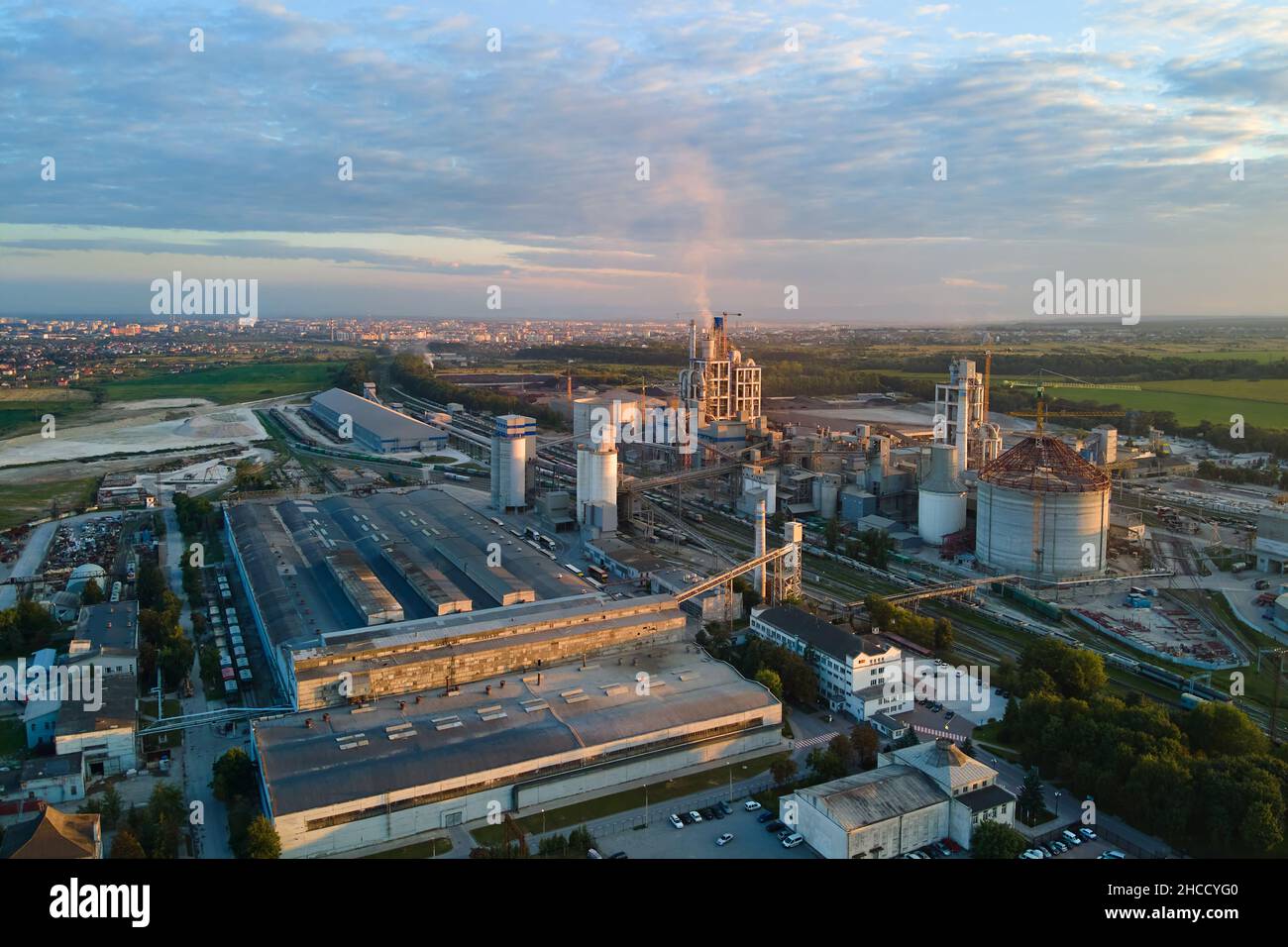 Aerial view of cement factory tower with high concrete plant structure ...