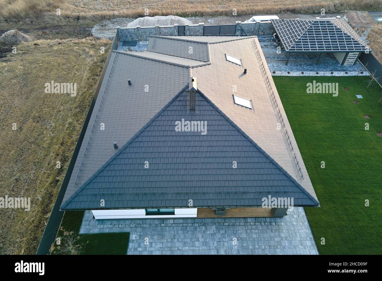 Aerial view of private house with ceramic shingles covered roof top ...