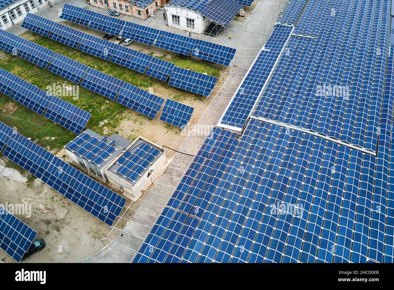 Aerial view of solar power plant with blue photovoltaic panels mounted ...