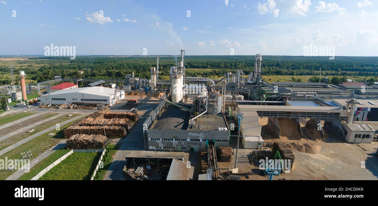Aerial view of wood processing factory with stacks of lumber at plant ...