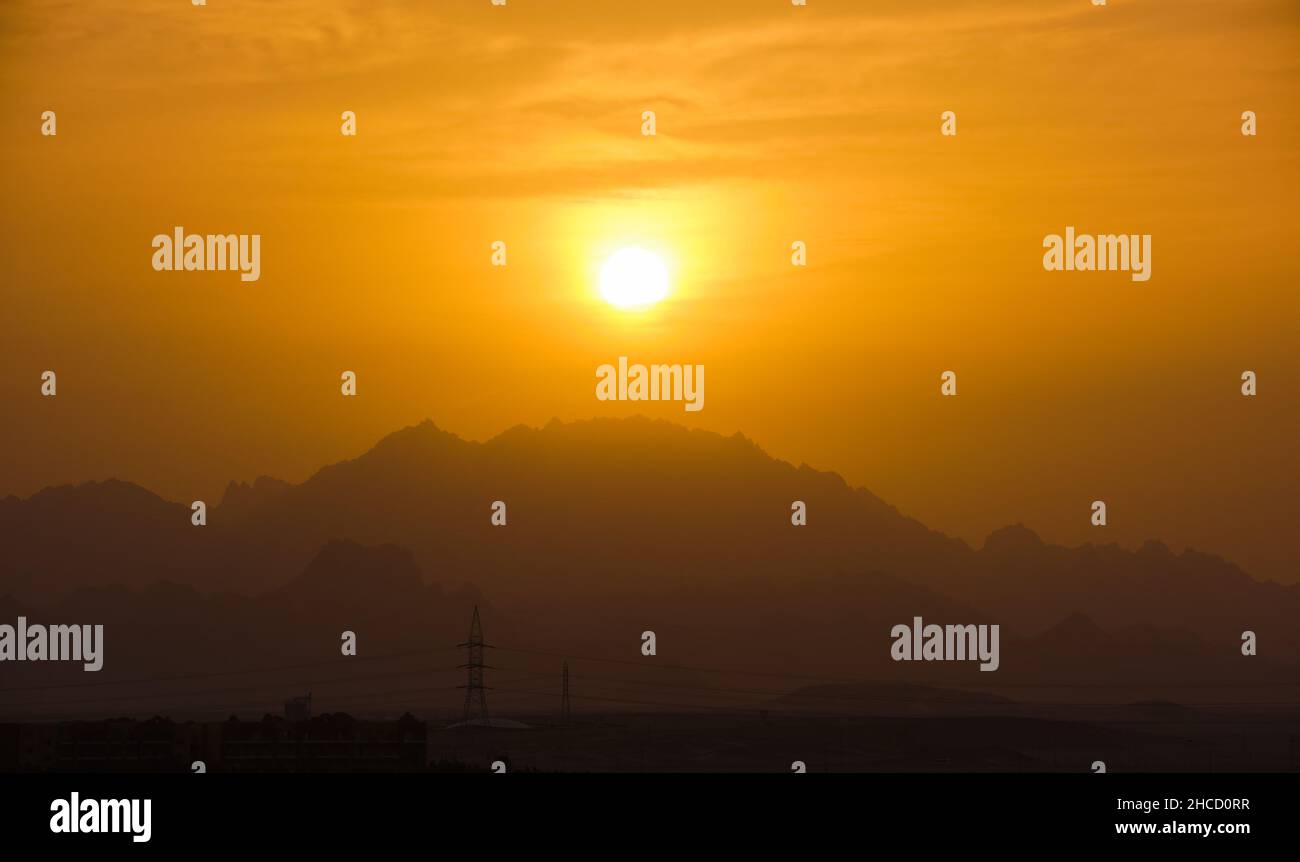 Beautiful evening panoramic landscape with bright setting sun over ...