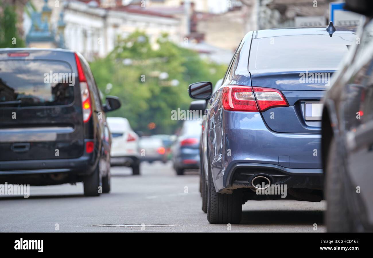 City traffic with cars parked in line on street side Stock Photo - Alamy