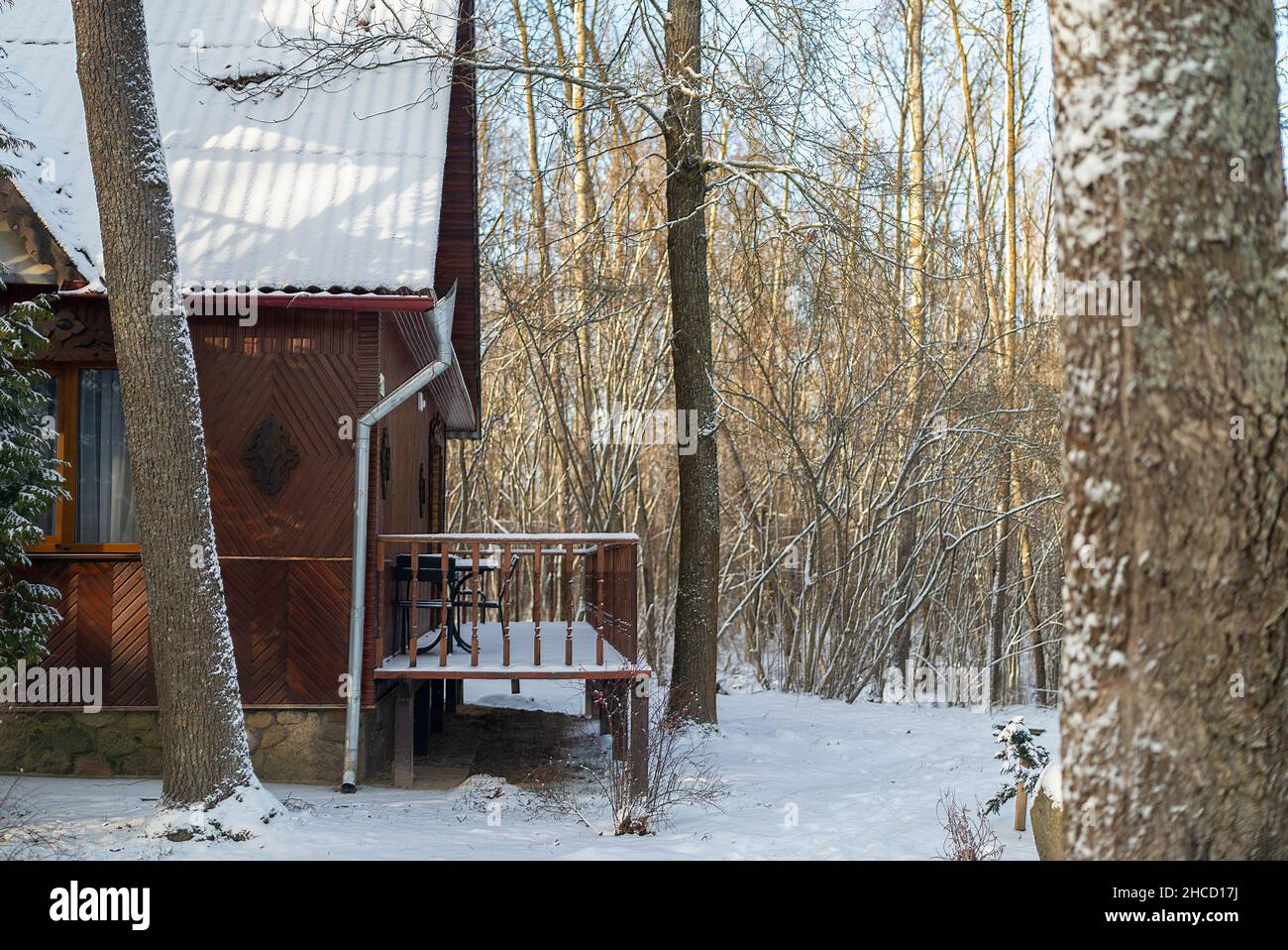 wooden porch snow-covered wooden house in winter forest Stock Photo - Alamy