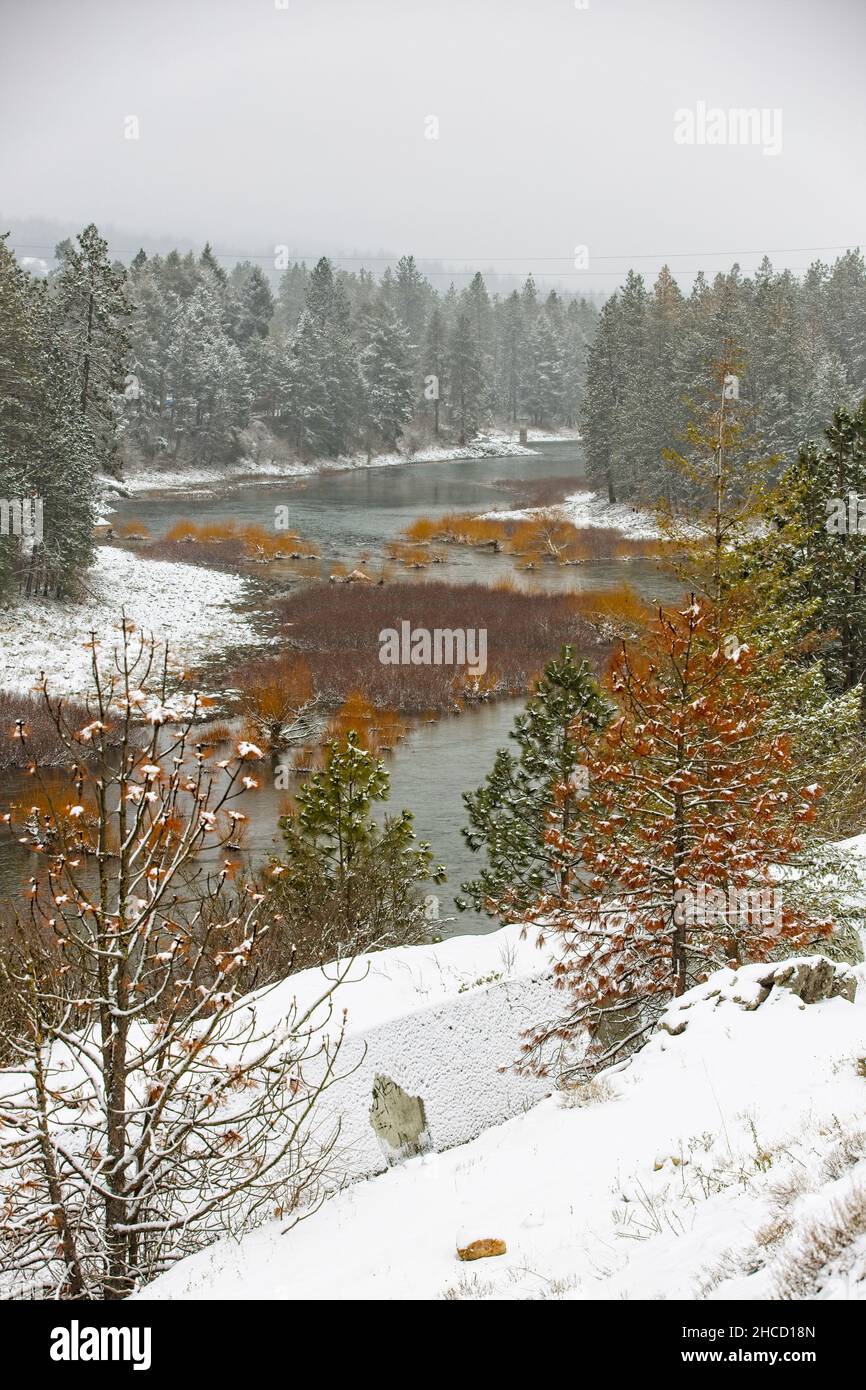The winding Spokane River in winter under an overcast sky in Post Falls ...