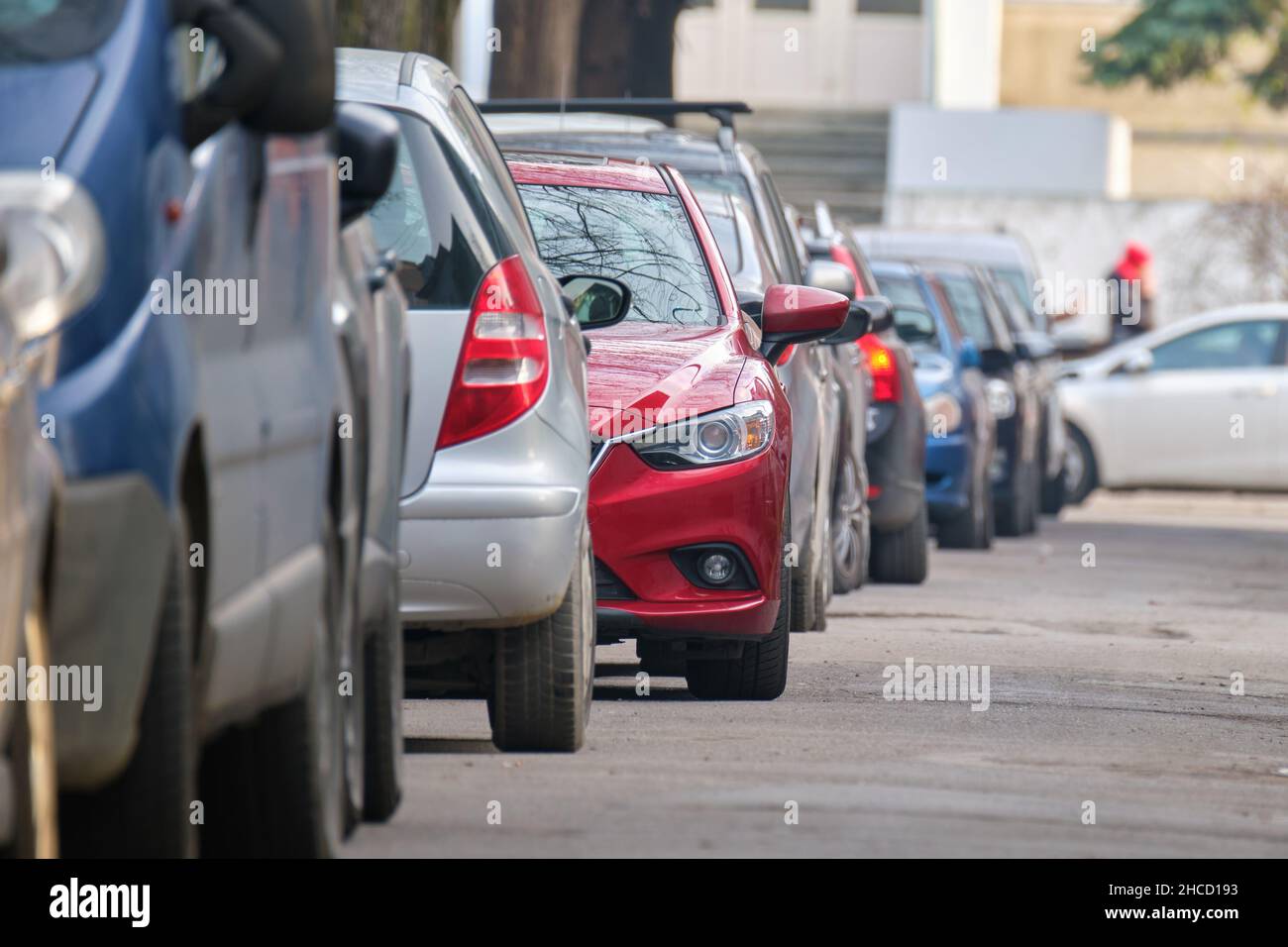 City traffic with cars parked in line on street side Stock Photo - Alamy