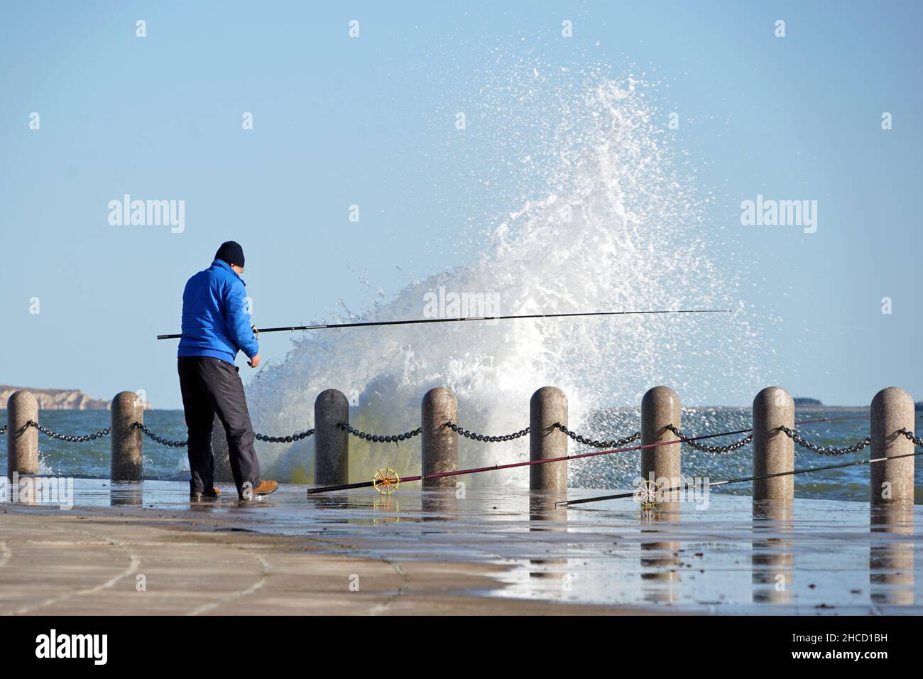 YANTAI, CHINA - NOVEMBER 12, 2021 - A citizen fishes at a beach in ...
