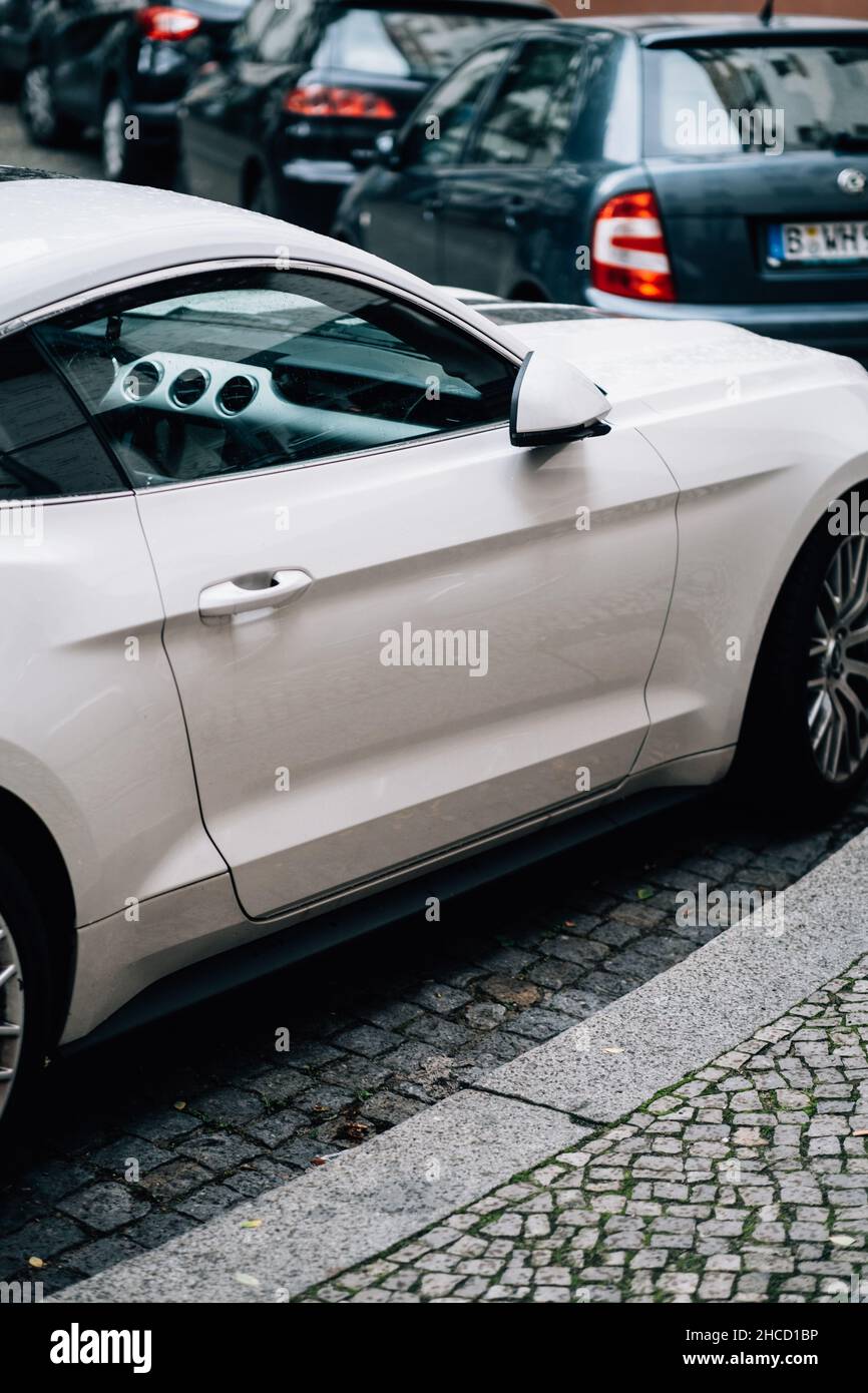 Vertical shot of a white car side Stock Photo - Alamy