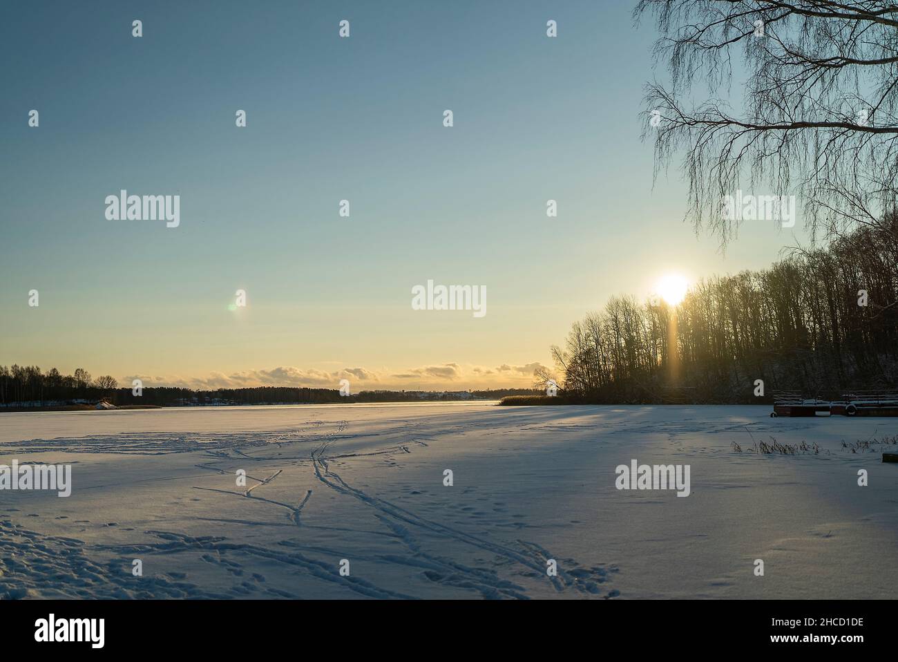 winter landscape ice-covered lake in the setting sun Stock Photo - Alamy