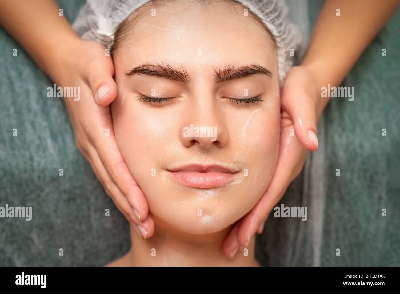 Spa facial skincare. Close-up of a young caucasian woman getting spa ...