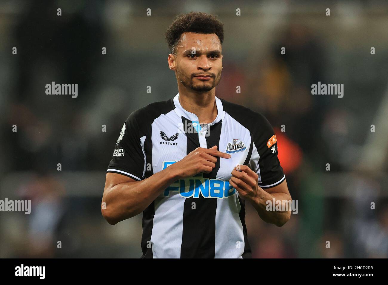 Jacob Murphy #23 of Newcastle United points to the Newcastle badge on ...