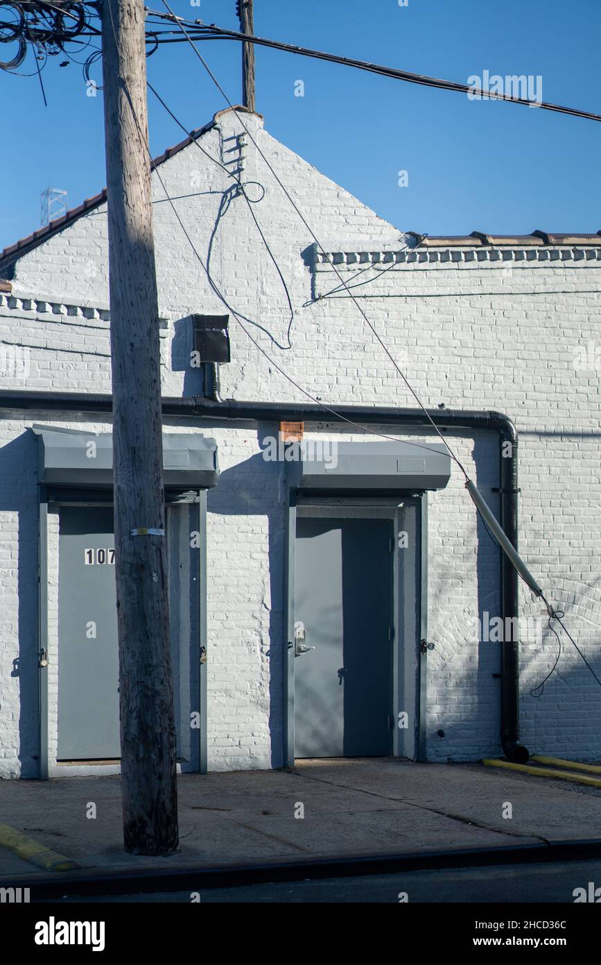 Vertical shot of the doors and exterior design of a white building with ...