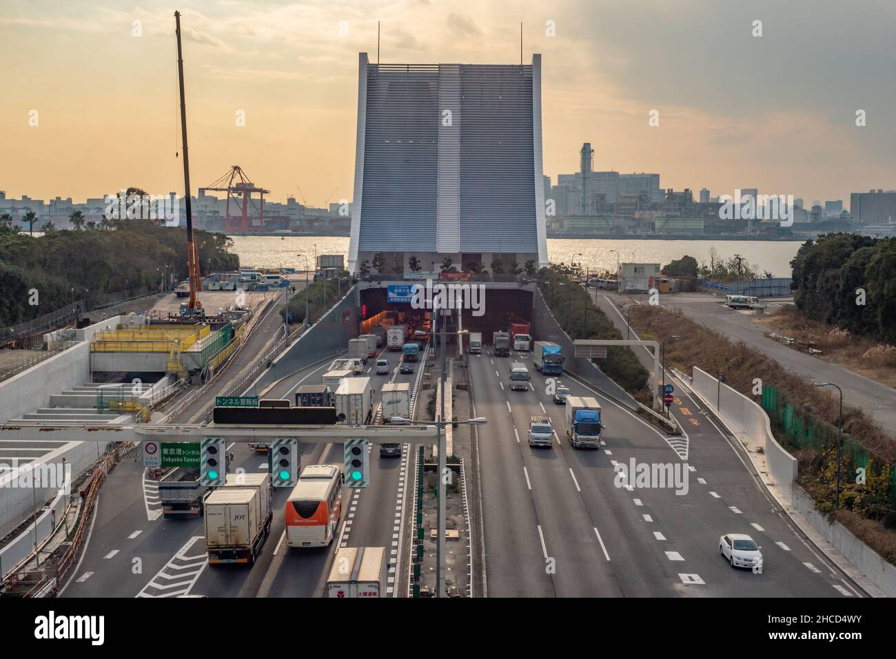 Vehicles entering and exiting an underwater tunnel in Tokyo, Japan ...