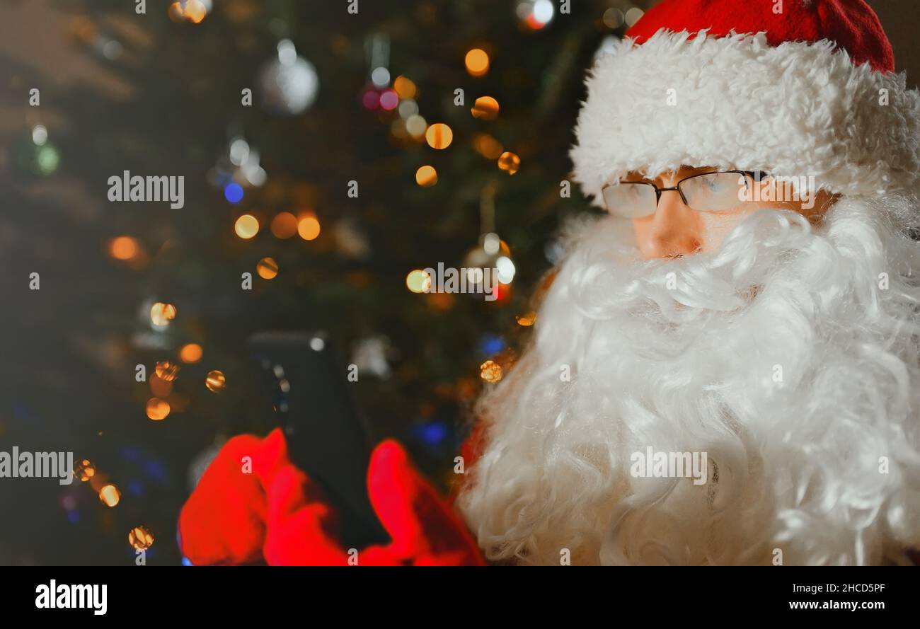 Video santa claus using smartphone hi-res stock photography and images ...