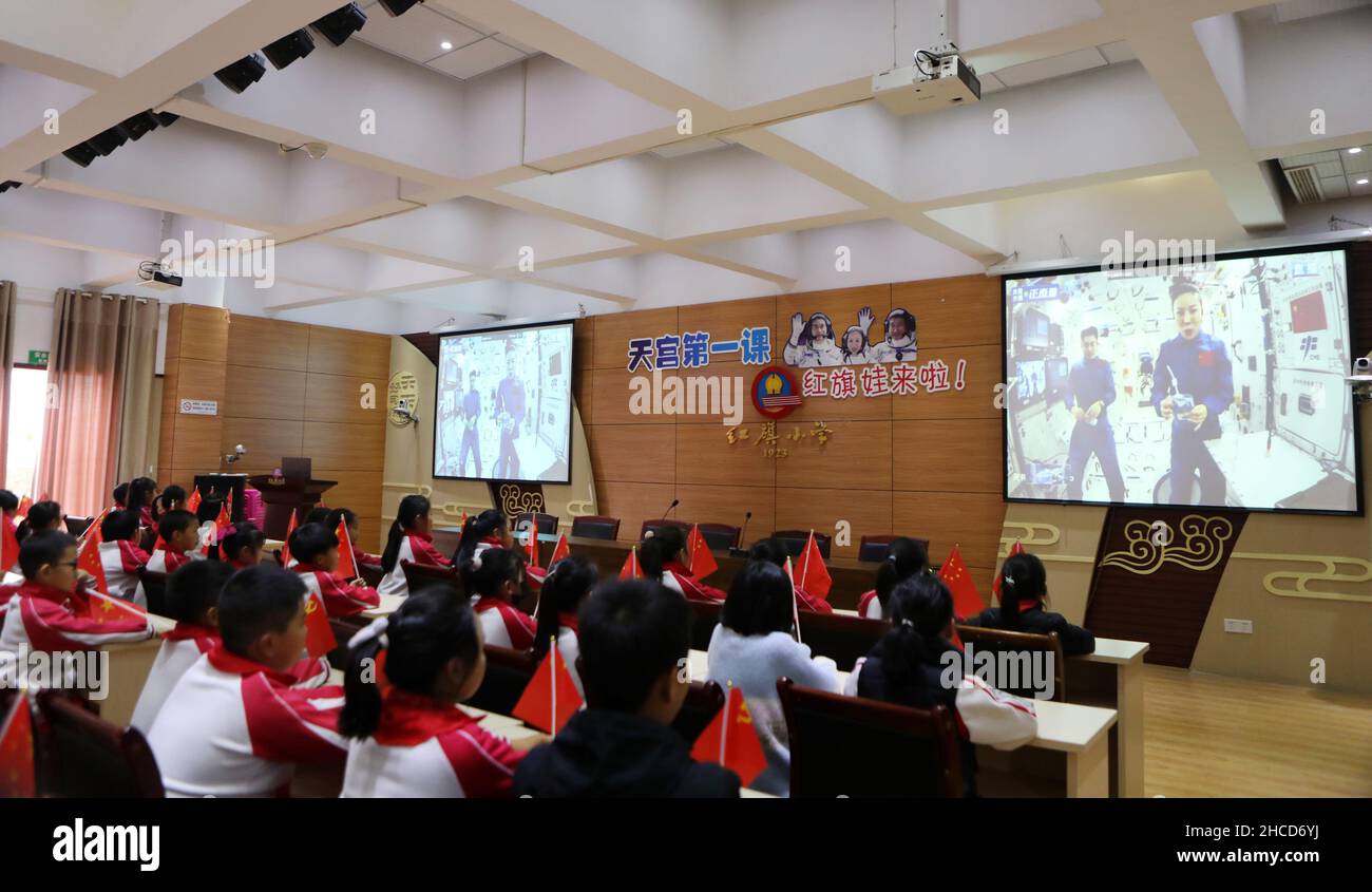 CHONGQING, CHINA - DECEMBER 9, 2021 - Students watch the first class of ...