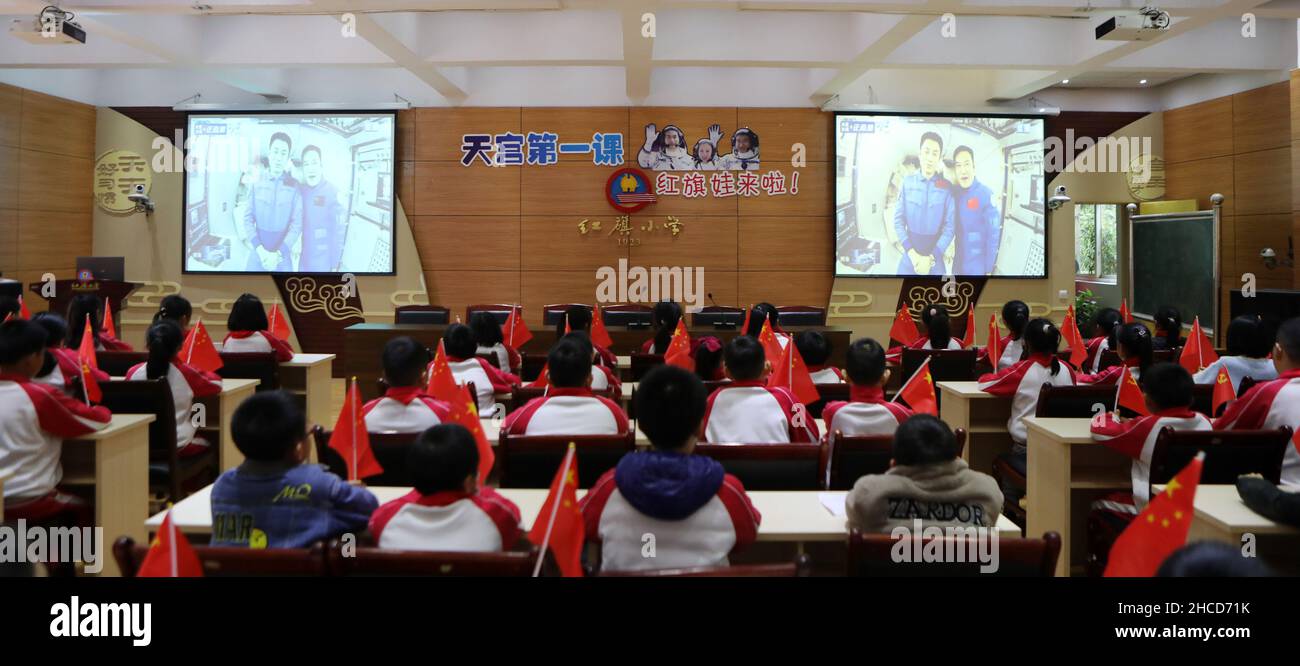 CHONGQING, CHINA - DECEMBER 9, 2021 - Students watch the first class of ...